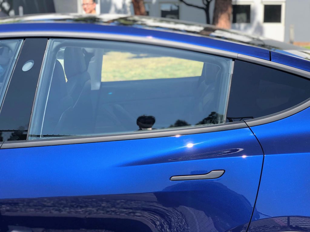 Blue Tesla Model Y walk around video shows glimpse of third row seats ...