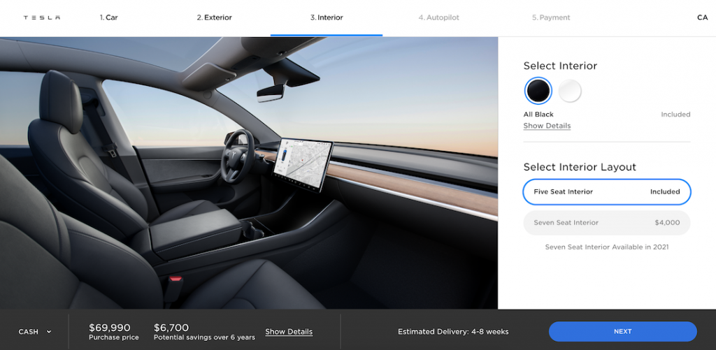 The rear cargo area in the 7-seat Model Y is completely flat thanks to ...