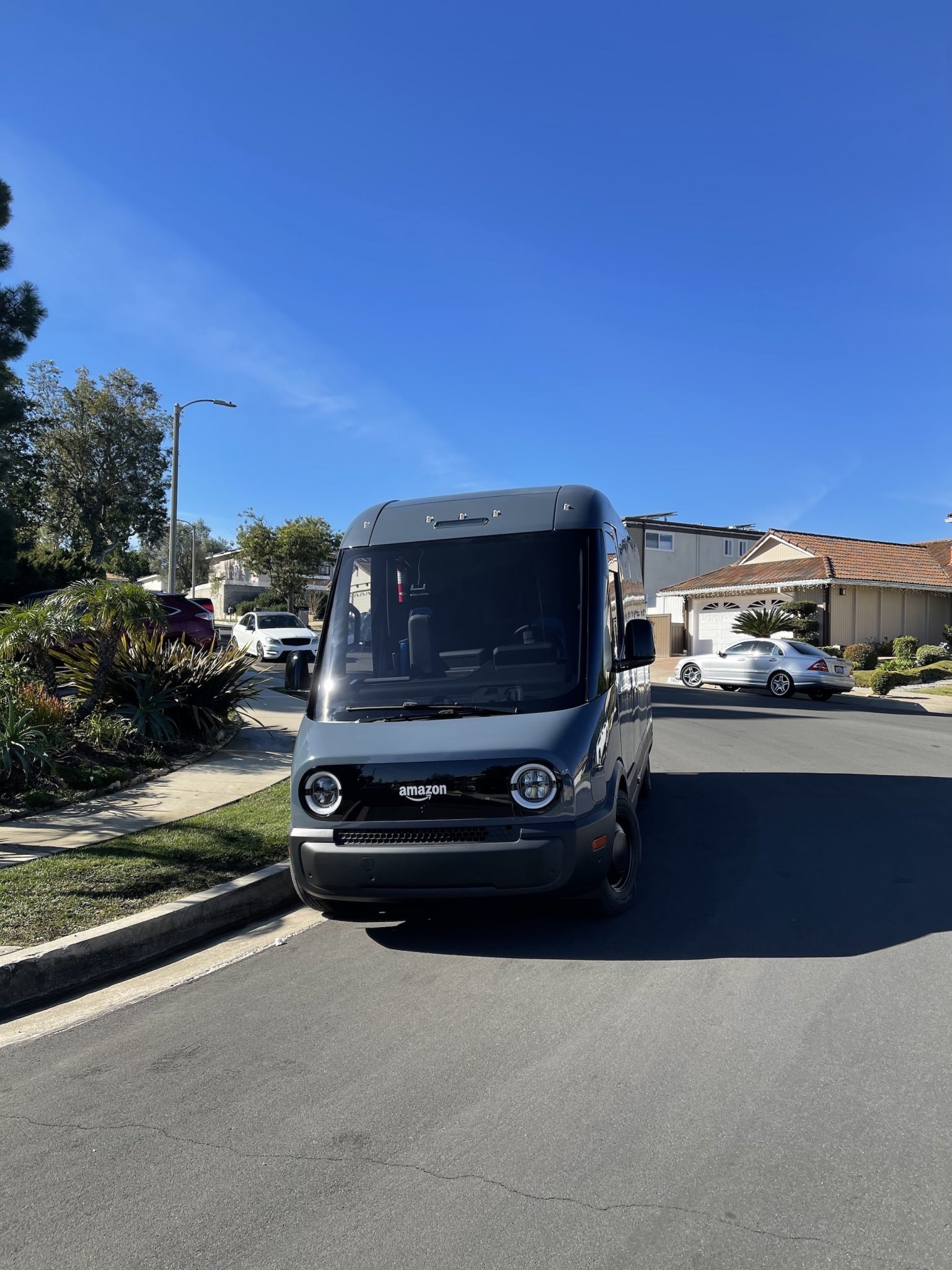 Rivian's Amazon delivery van spotted dropping off packages in Los ...