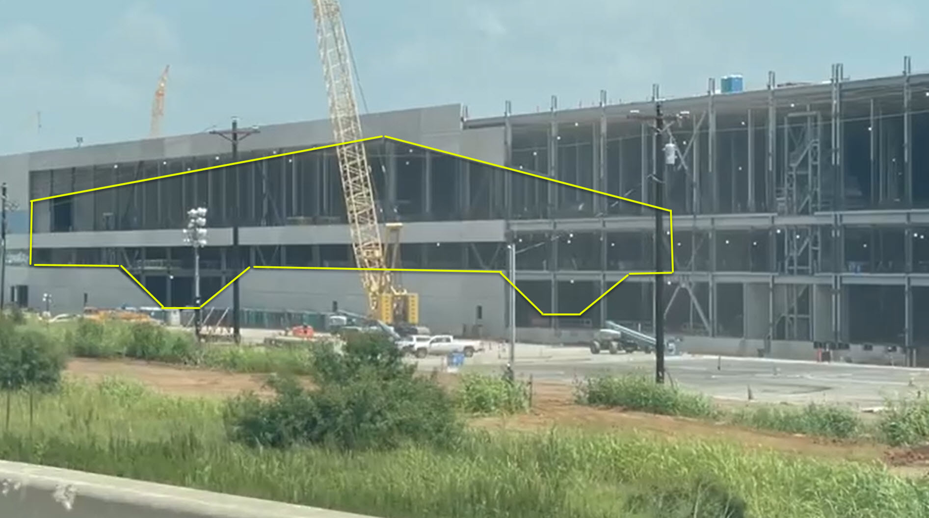 Tesla installing massive Cybertruck silhouette on side of Giga Texas ...